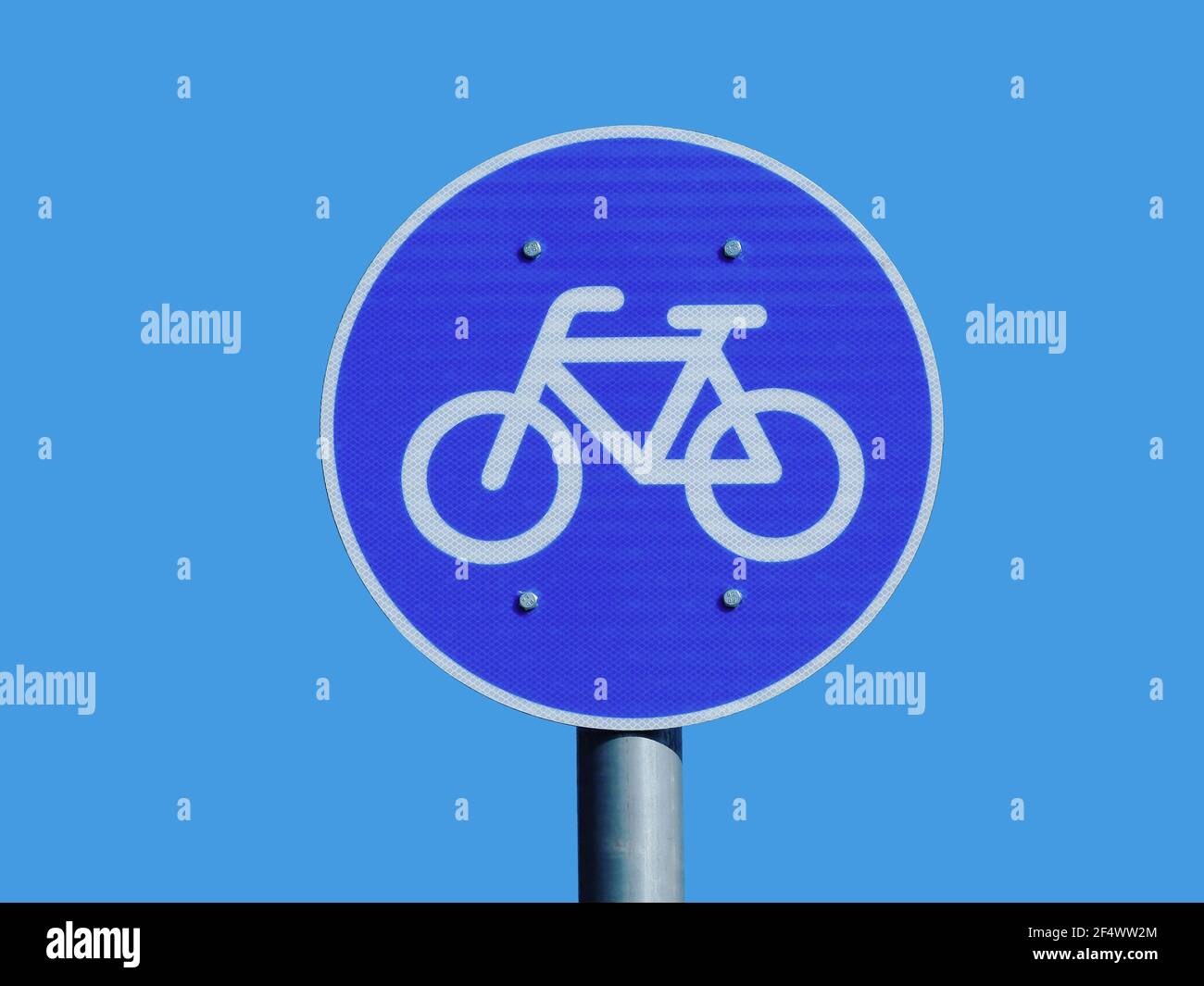 Blue circular road and traffic metal plate sign. white border. bicycle ...