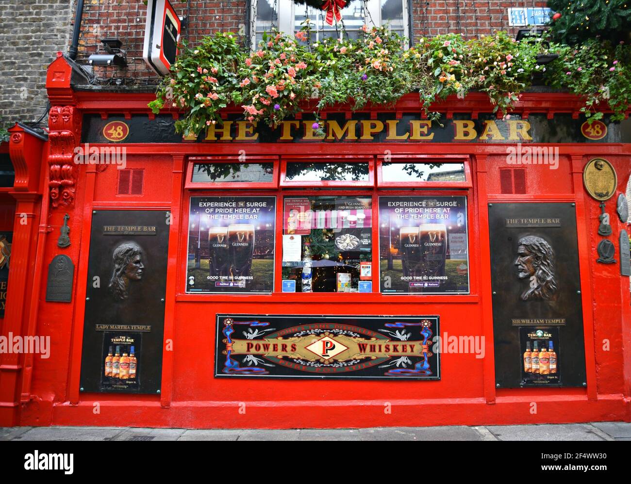 The iconic red facade of the Temple Bar Pub on the south bank of the ...