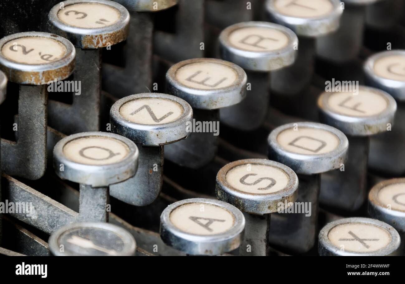 Keys of an old typewriter. Round and dusty keys. Work tool for writers ...