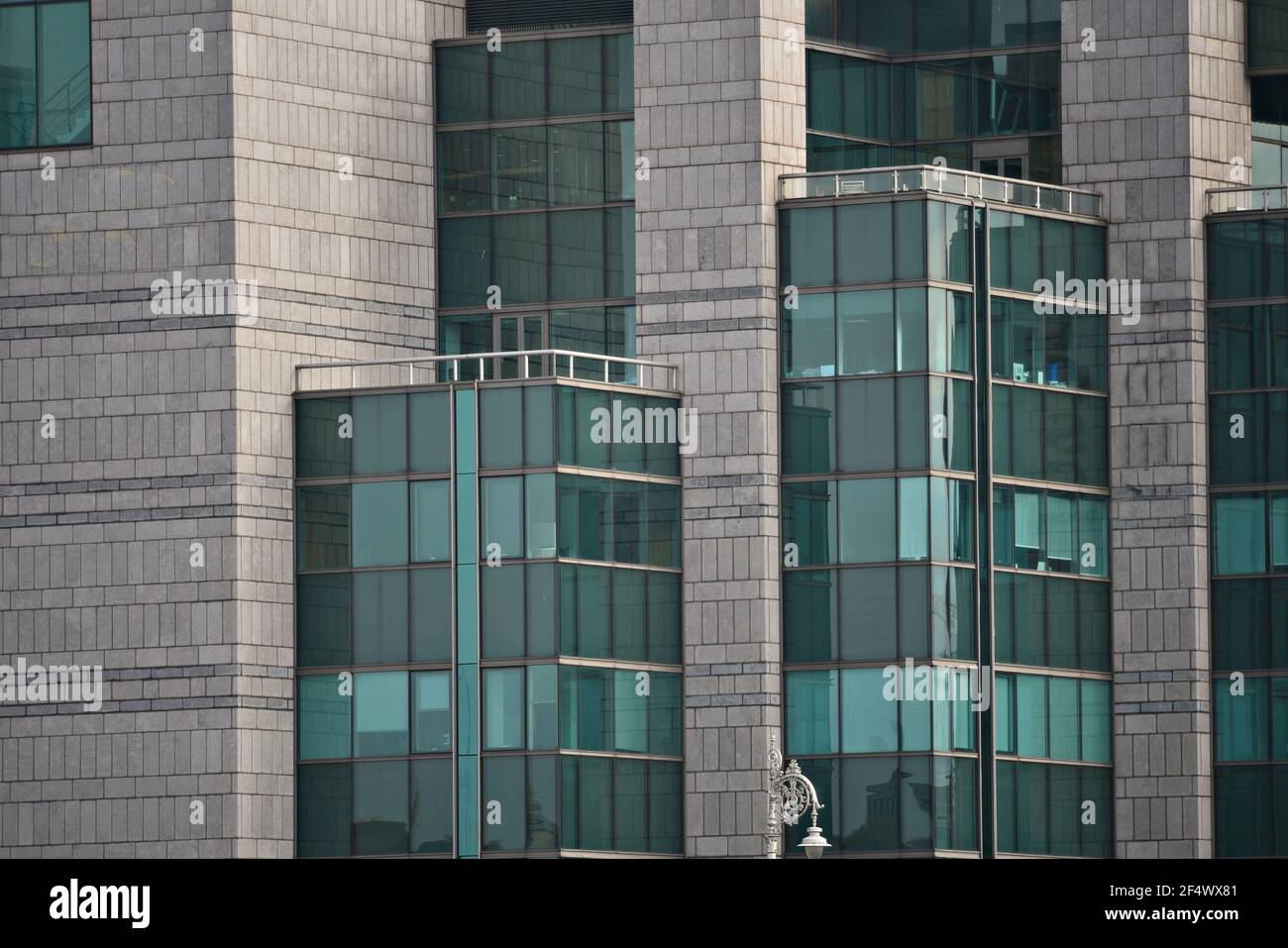 Commercial building stone and glass facade in downtown Dublin, Ireland ...