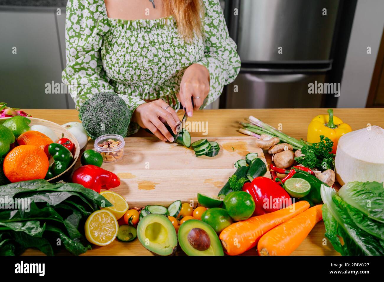 Asian girl cooking healthy vegetarian and vegan food, vegetables and ...