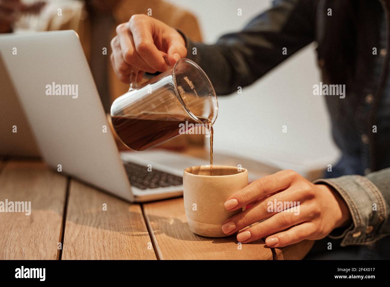 Man pouring coffee from glass hi-res stock photography and images - Alamy