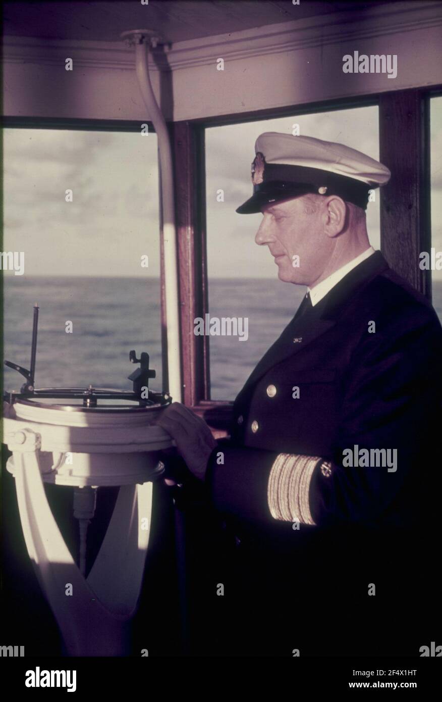 Bordle life. Captain at the compass of a passenger ship Stock Photo - Alamy