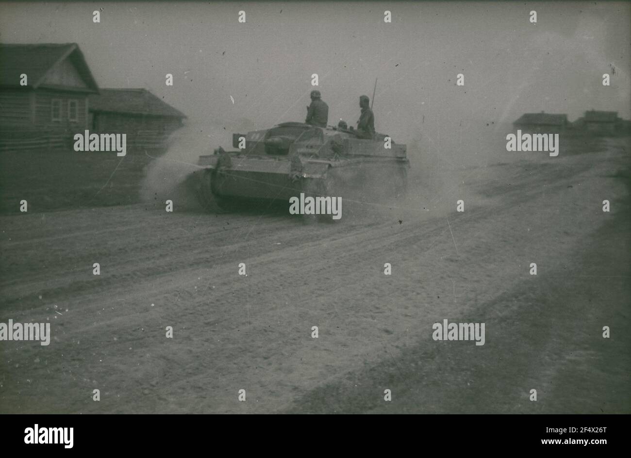 Second World War. Soviet Union. Battle breaks. Through a village ...