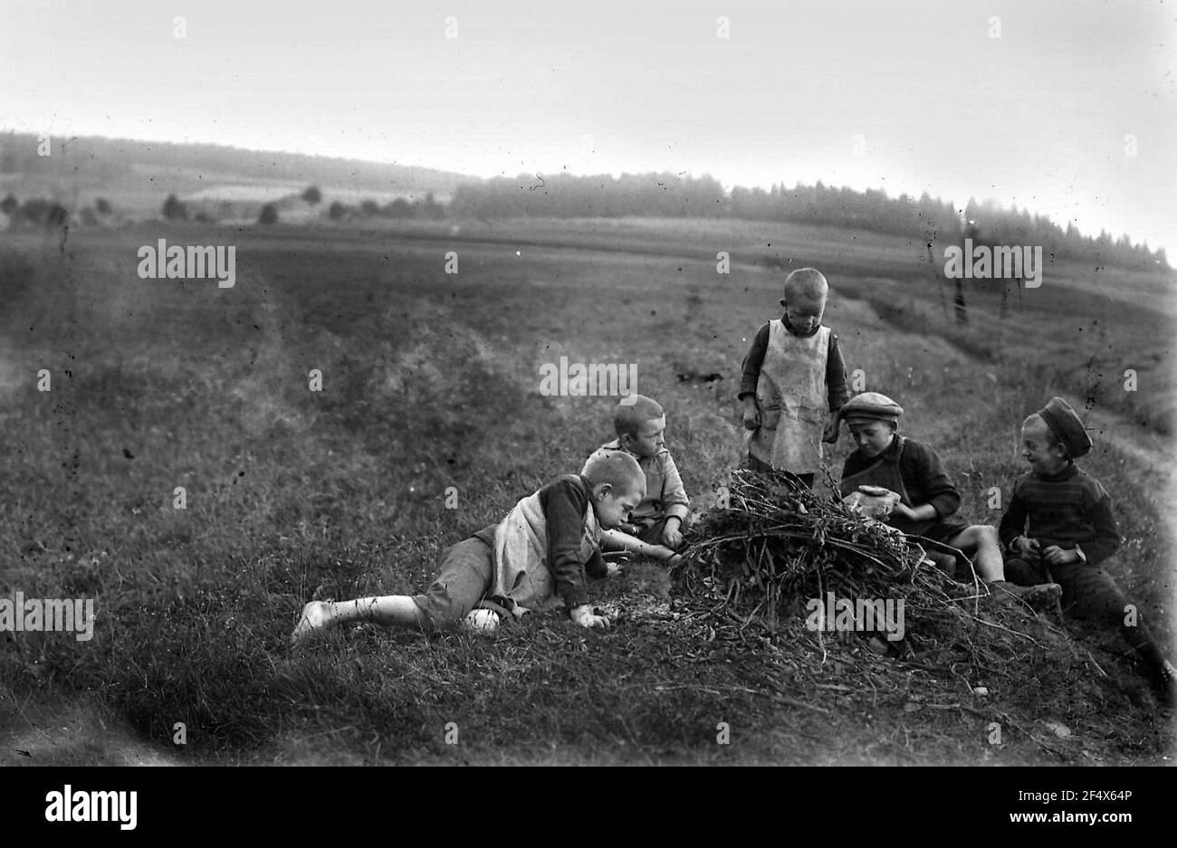 Children tending Black and White Stock Photos & Images - Alamy