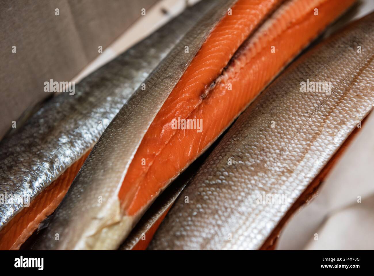 Smoked fish in craft paper box. Ready for delivery production. Smoked ...