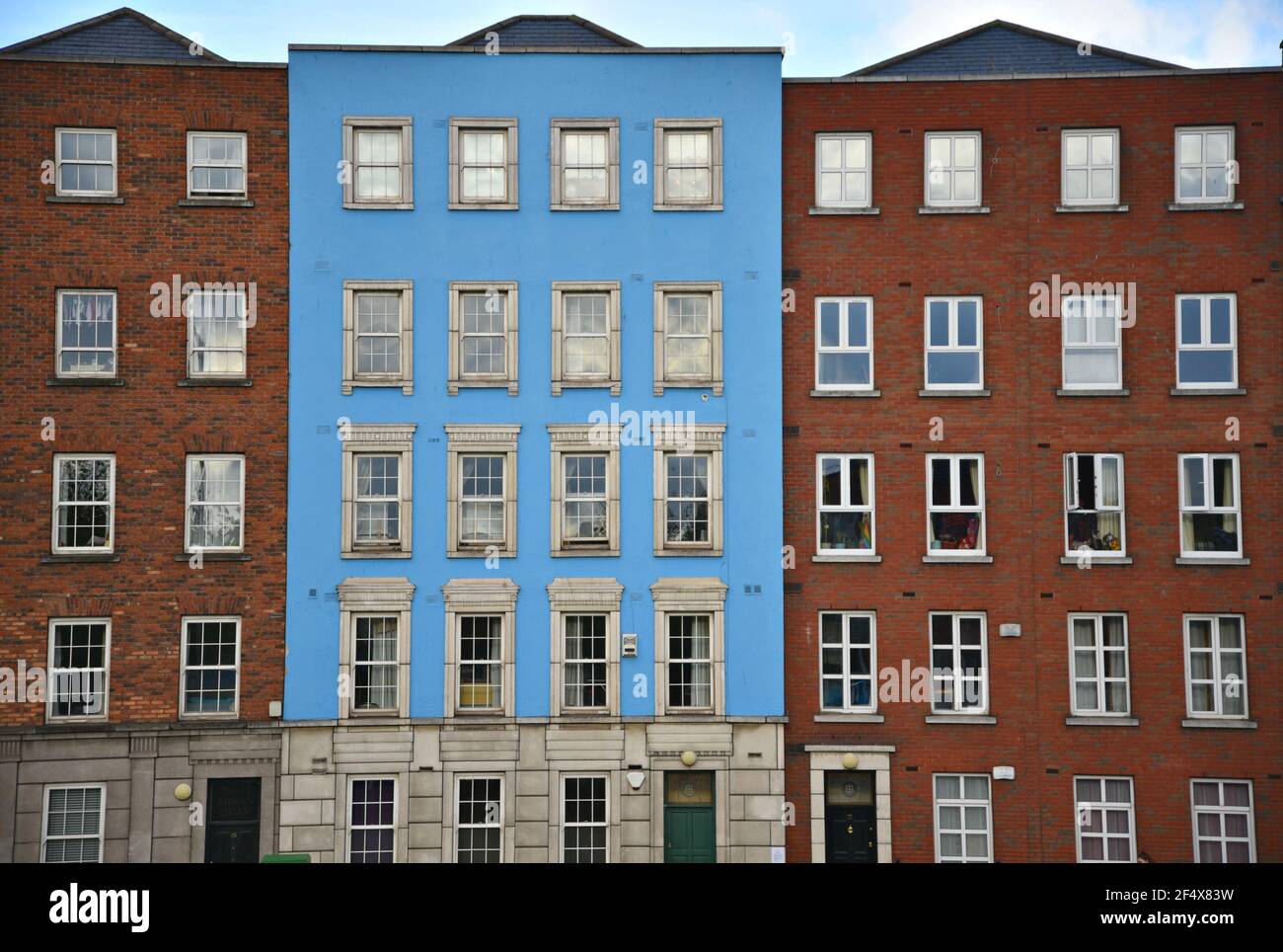 Facade view of old traditional brick buildings in downtown Dublin ...