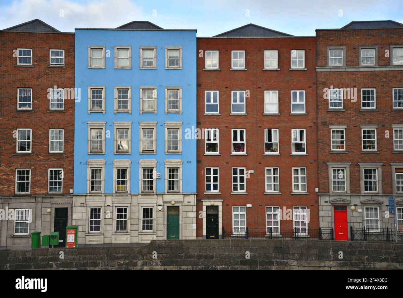 Facade view of old traditional brick buildings in downtown Dublin ...