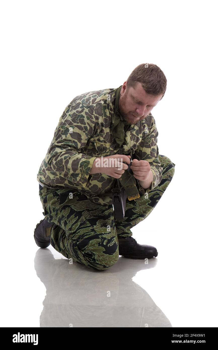 Man actor in the form of an American fur seal posing with a machine gun ...