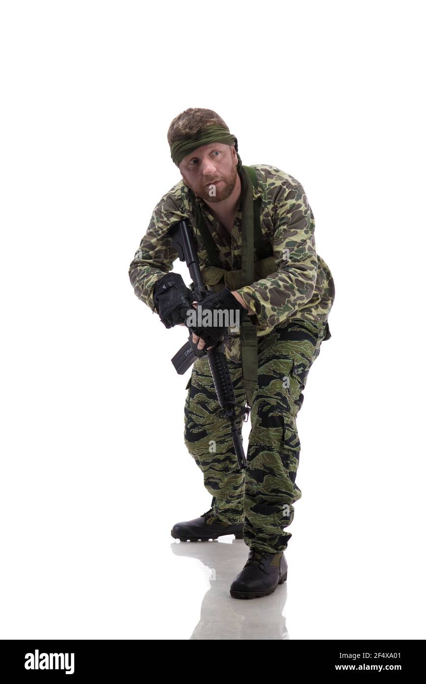 Man actor in the form of an American fur seal posing with a machine gun ...