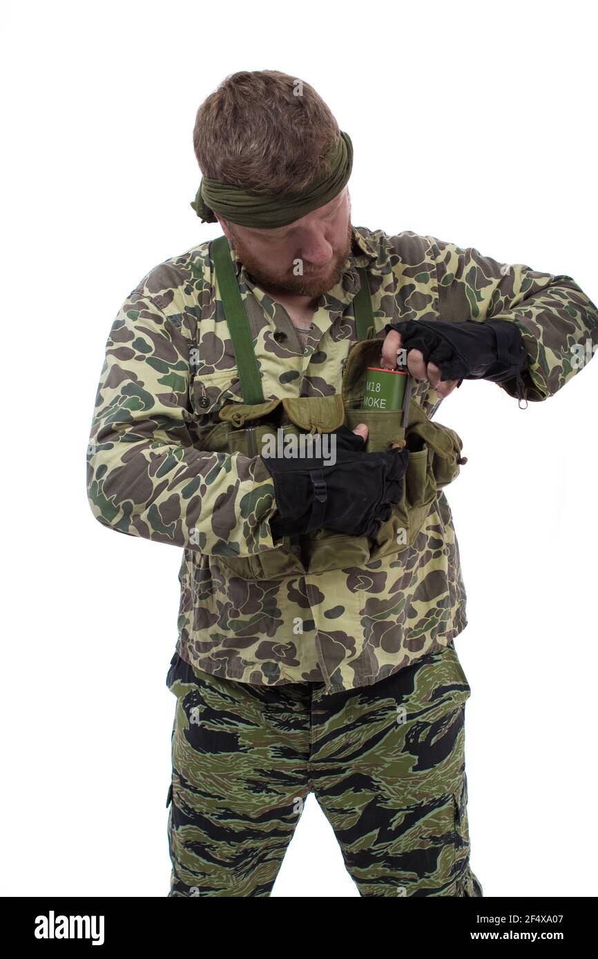 Man actor in the form of an American fur seal posing with a machine gun ...