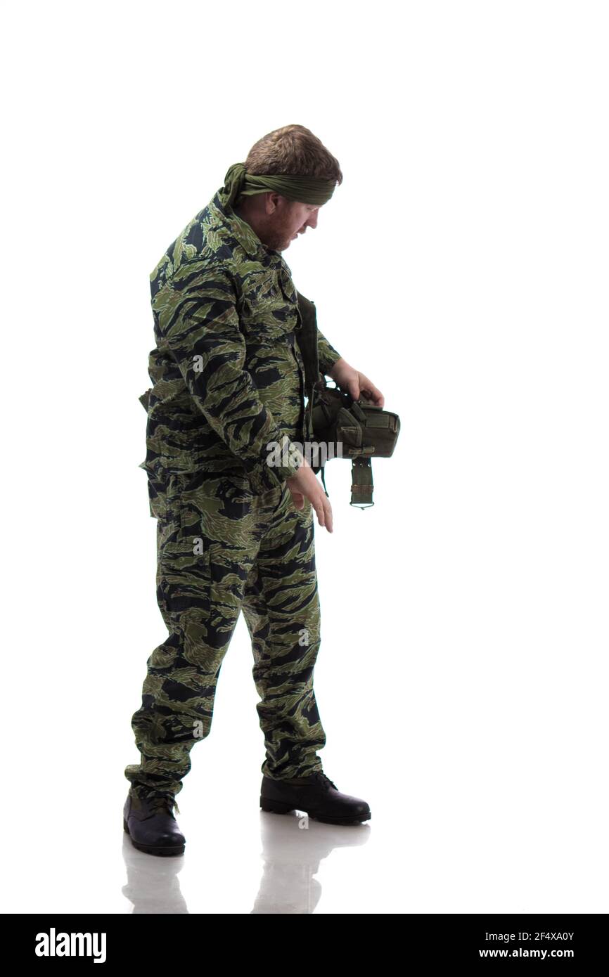 Man actor in the form of an American fur seal posing with a machine gun ...