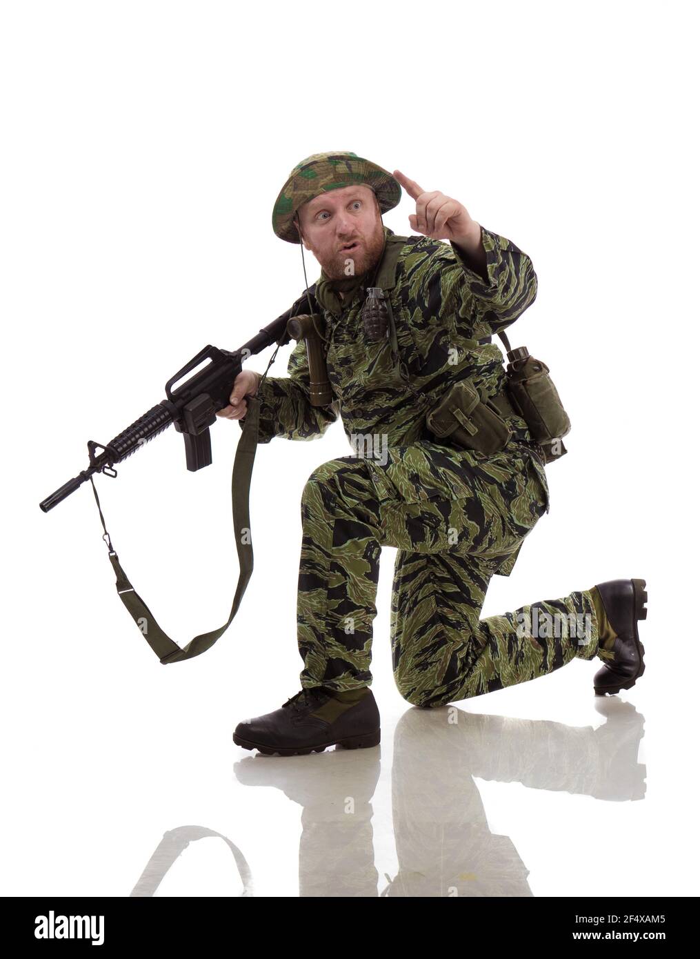 Man actor in the form of an American fur seal posing with a machine gun ...