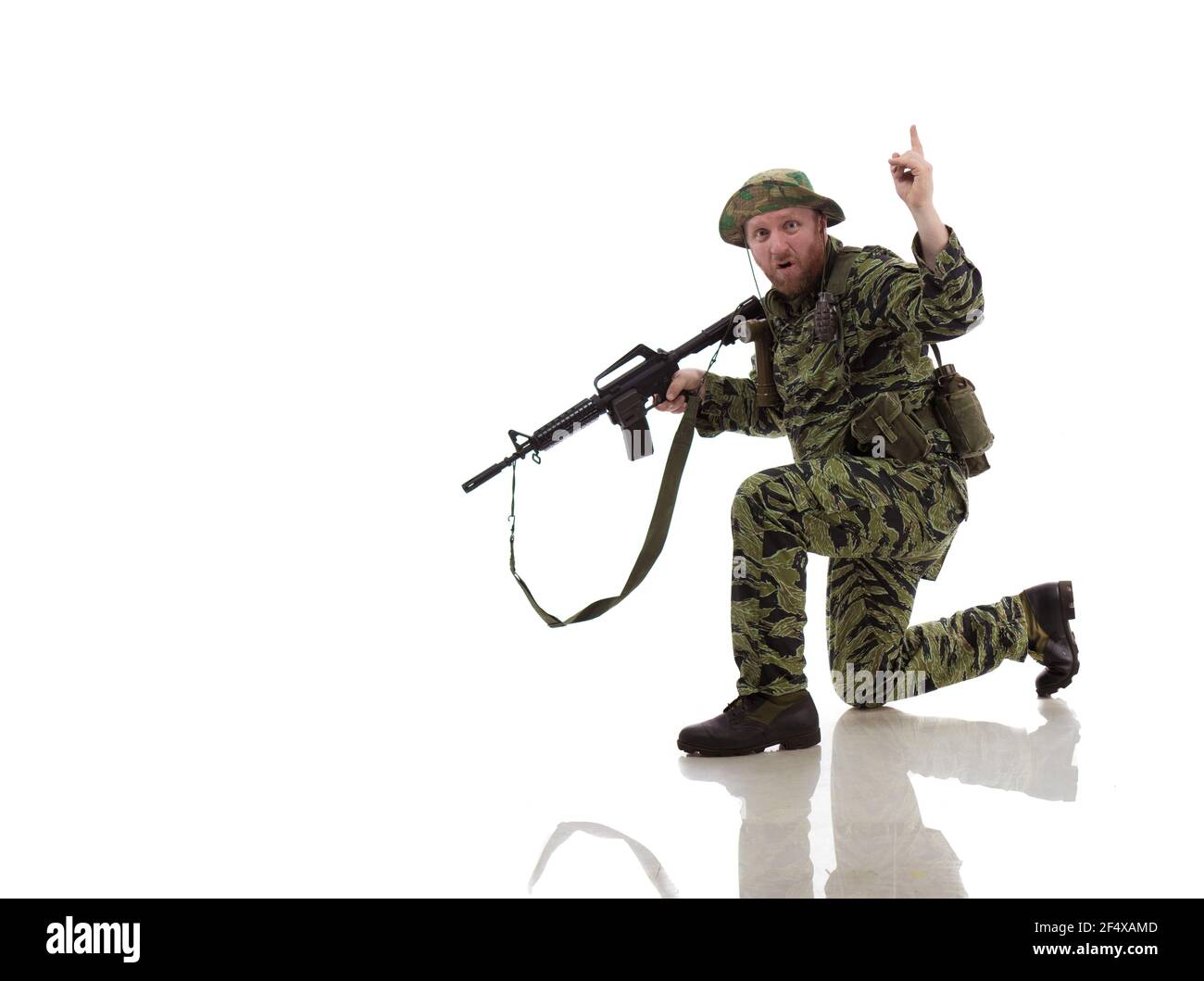 Man actor in the form of an American fur seal posing with a machine gun ...