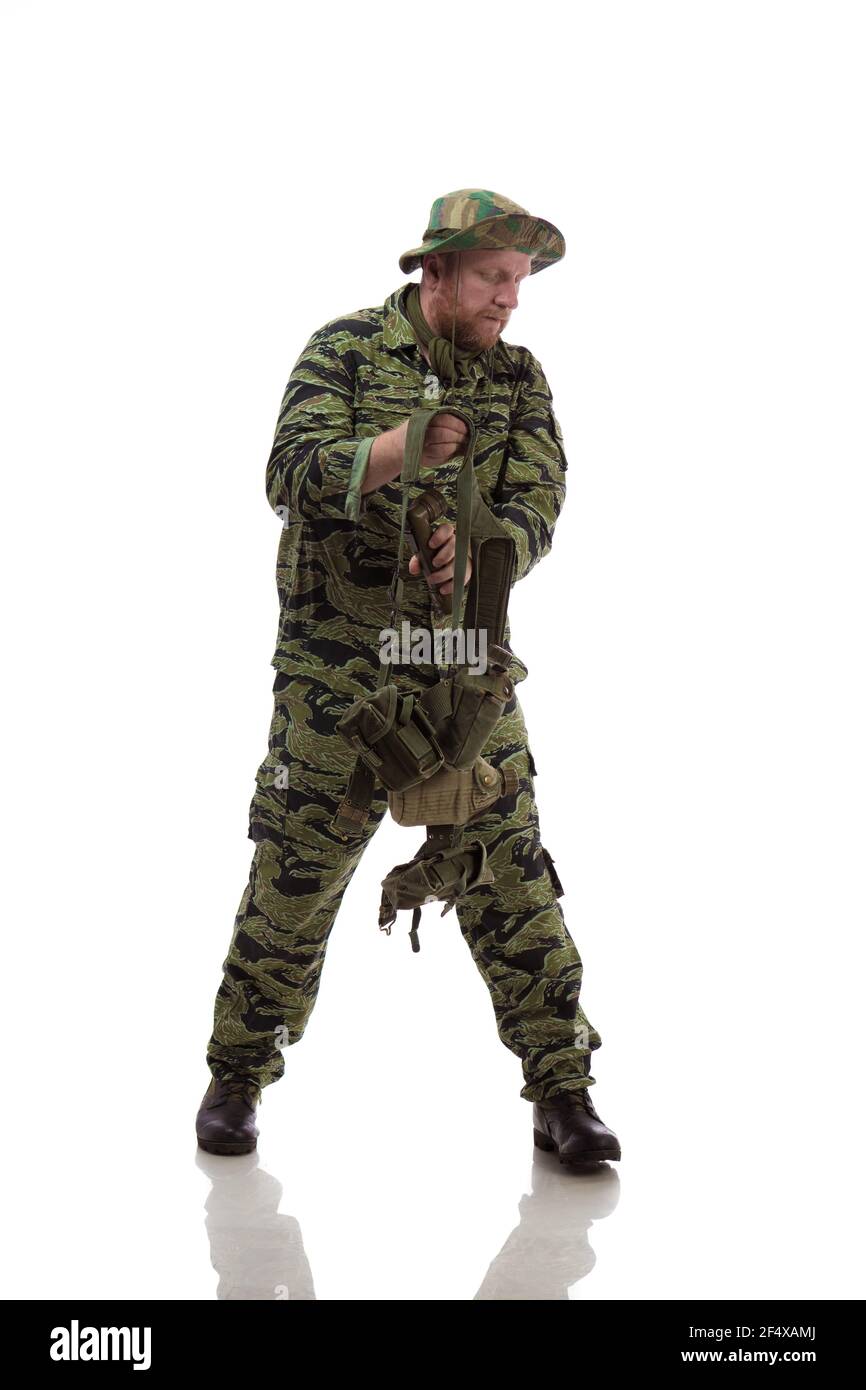 Man actor in the form of an American fur seal posing with a machine gun ...