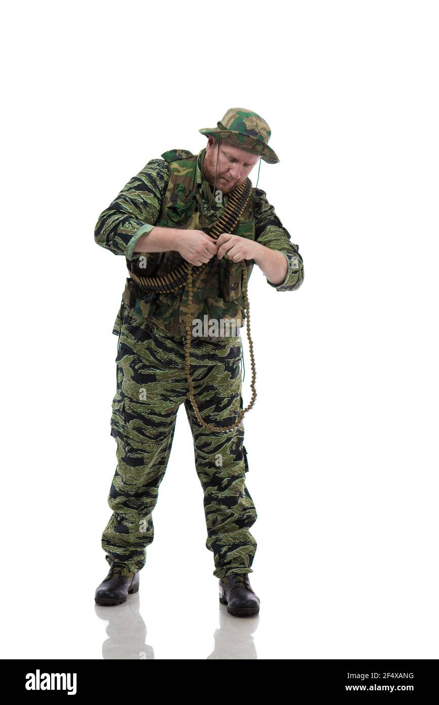 Man actor in the form of an American fur seal posing with a machine gun ...
