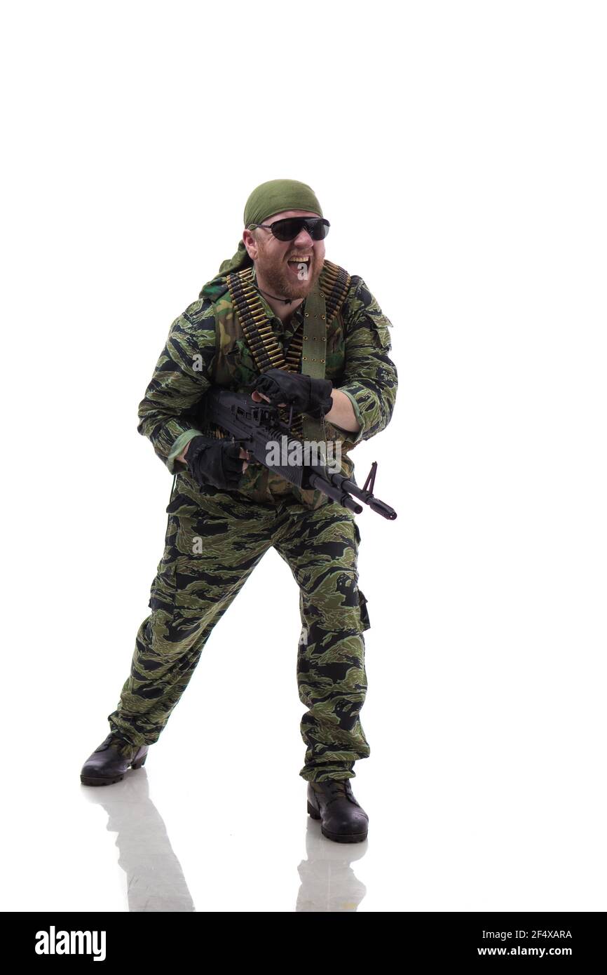 Man actor in the form of an American fur seal posing with a machine gun ...