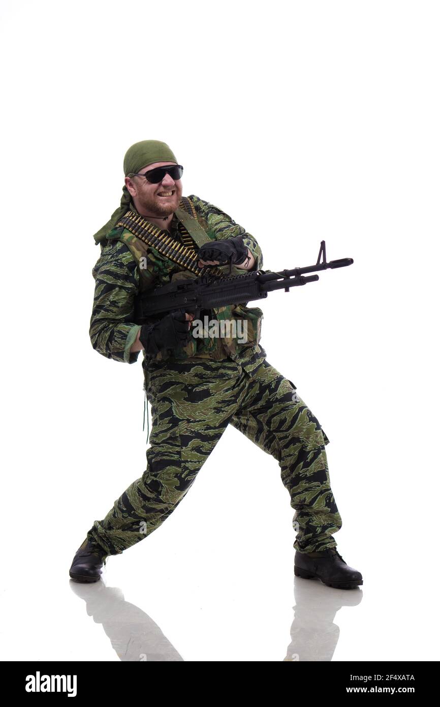 Man actor in the form of an American fur seal posing with a machine gun ...