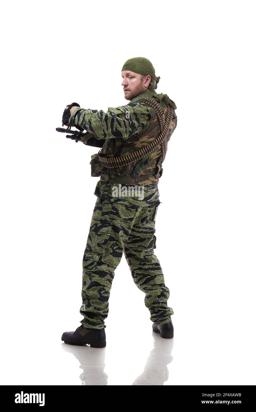 Man actor in the form of an American fur seal posing with a machine gun ...