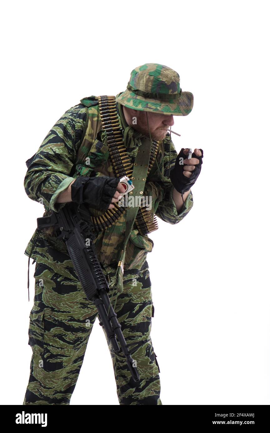 Man actor in the form of an American fur seal posing with a machine gun ...