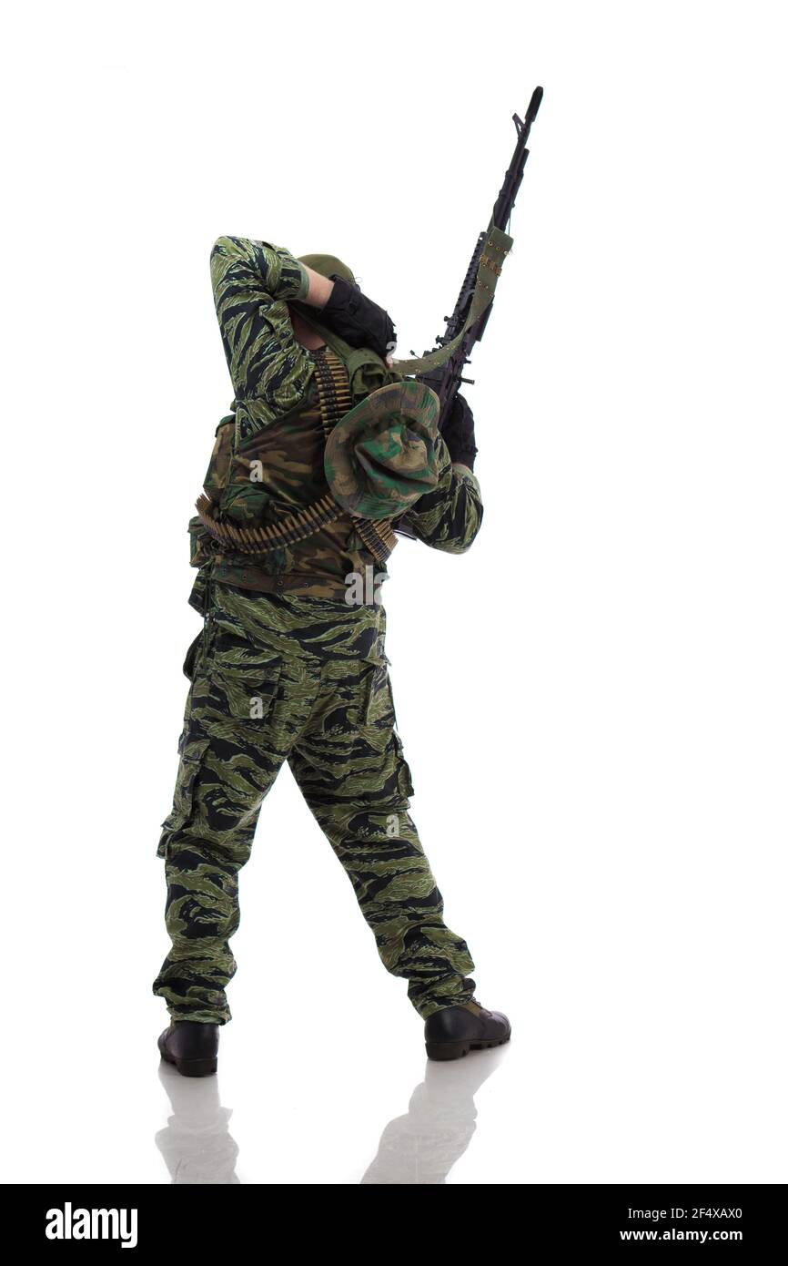 Man actor in the form of an American fur seal posing with a machine gun ...