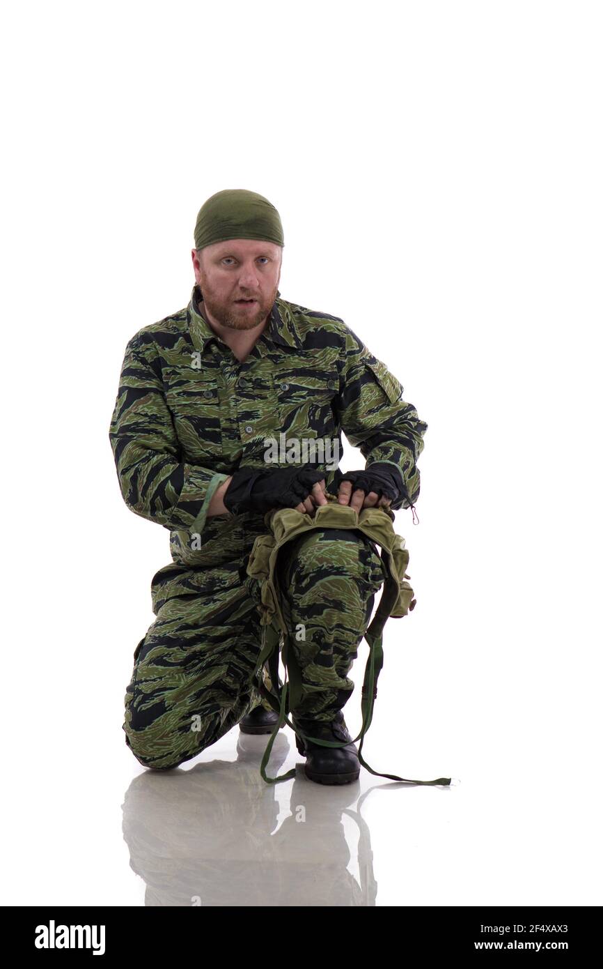 Man actor in the form of an American fur seal posing with a machine gun ...