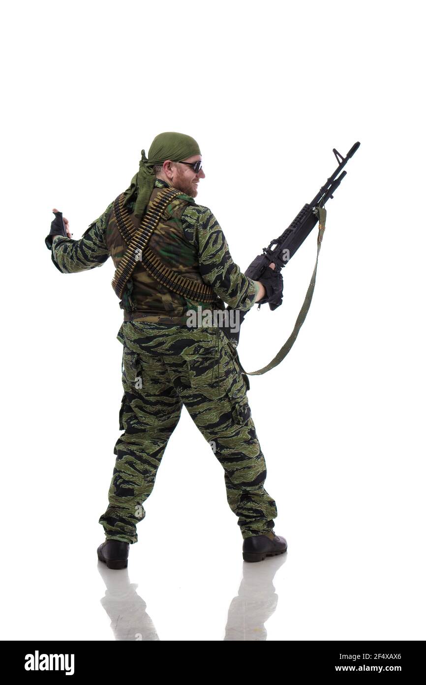 Man actor in the form of an American fur seal posing with a machine gun ...