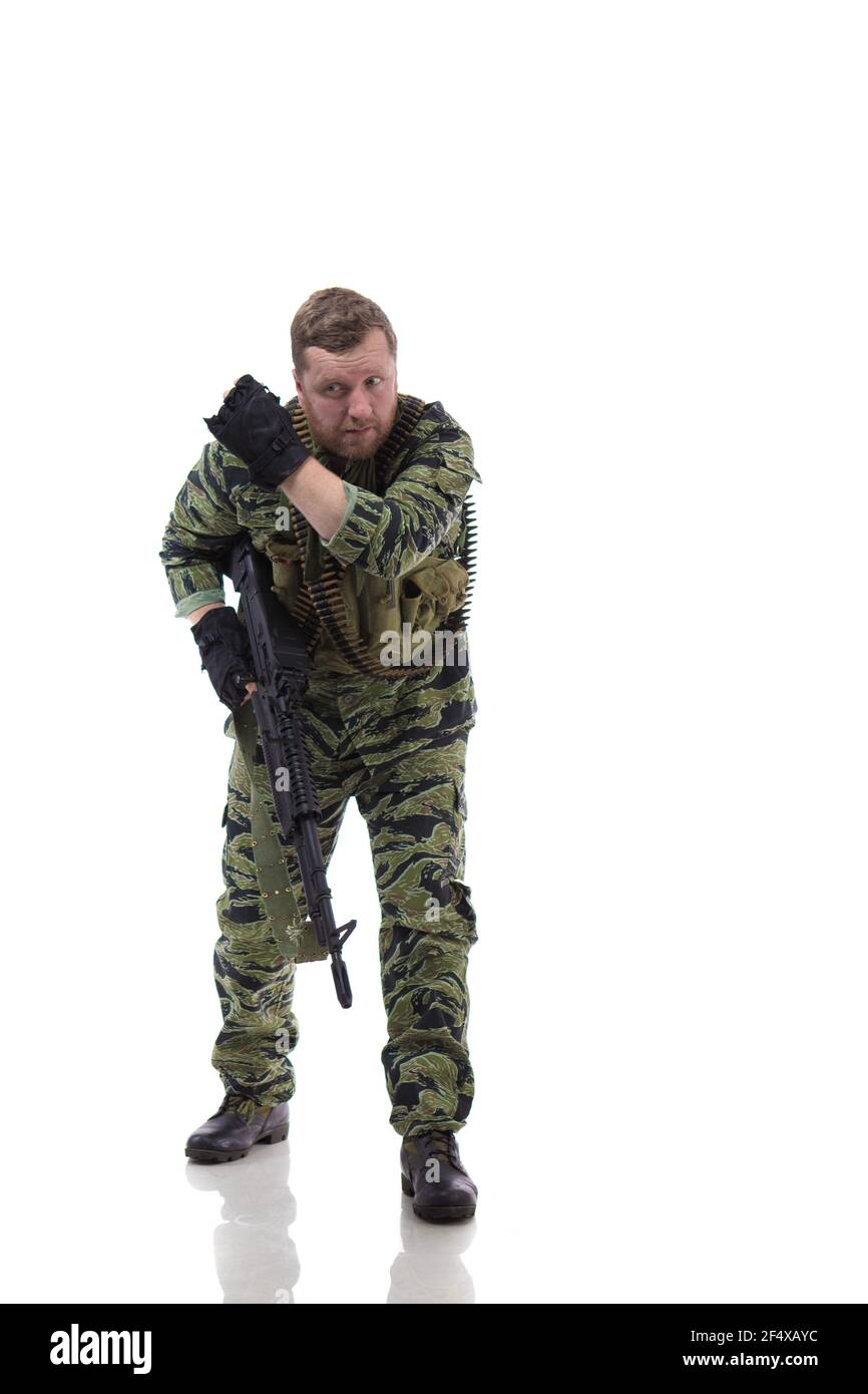 Man actor in the form of an American fur seal posing with a machine gun ...