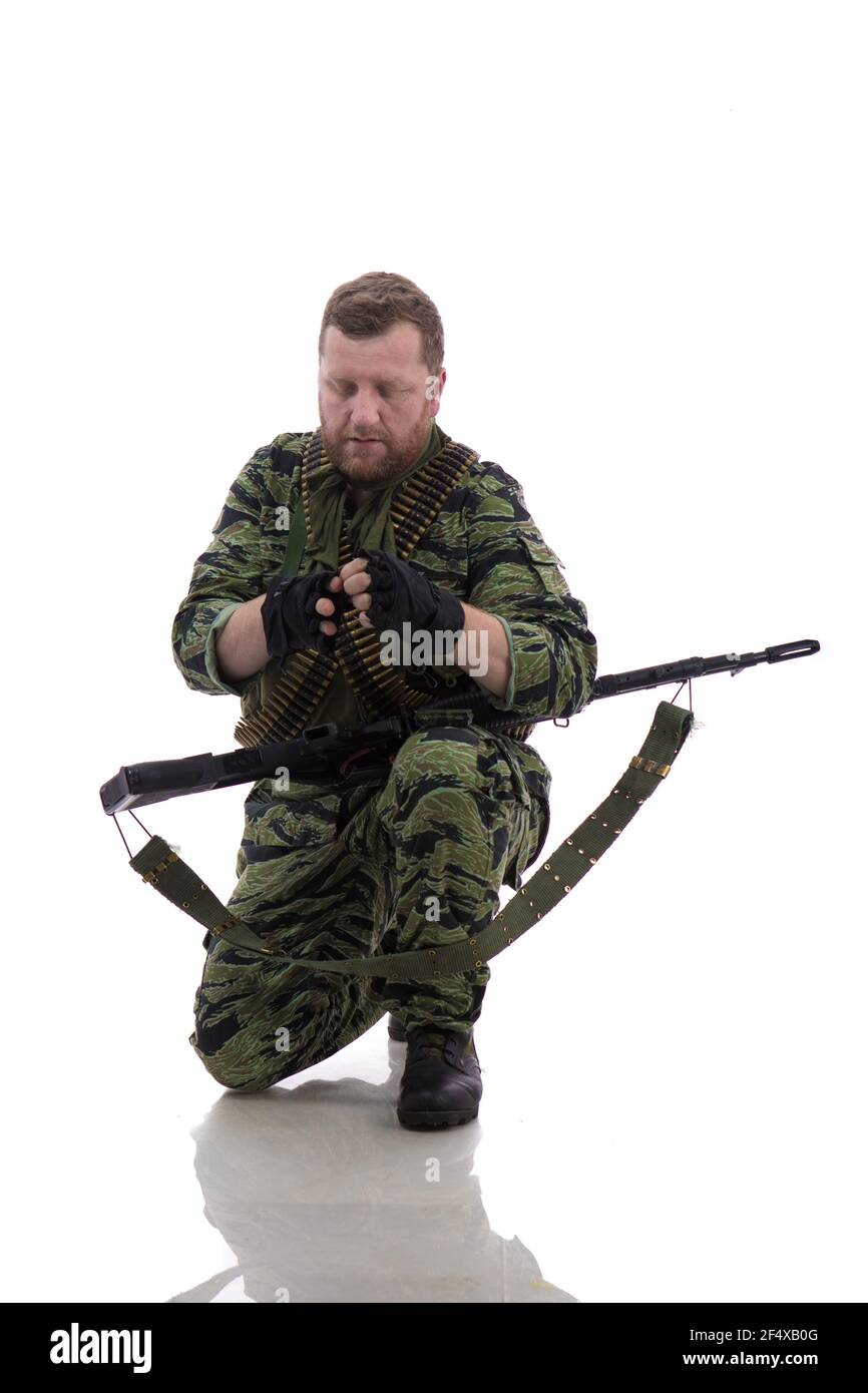 Man actor in the form of an American fur seal posing with a machine gun ...