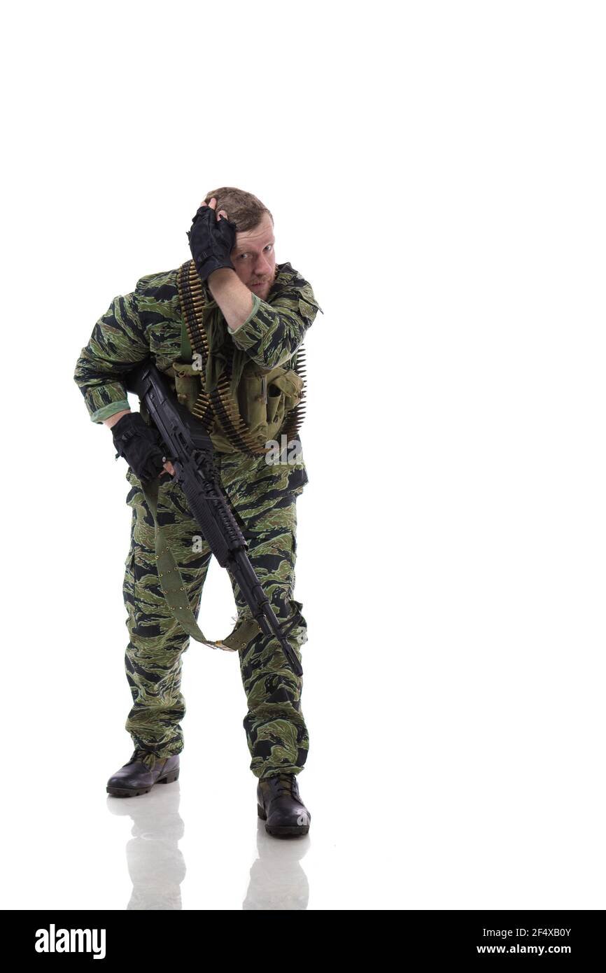 Man actor in the form of an American fur seal posing with a machine gun ...