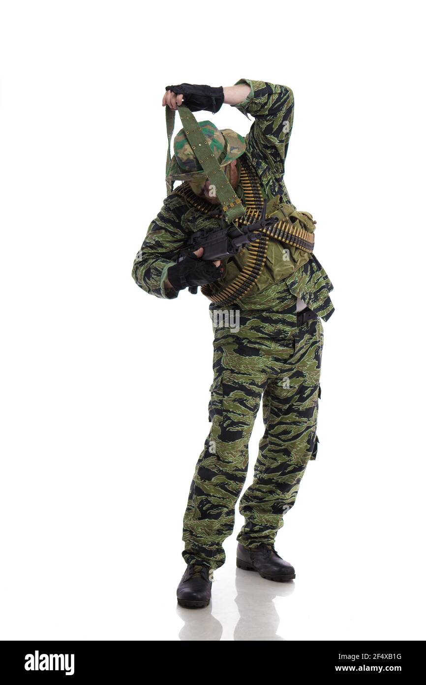 Man actor in the form of an American fur seal posing with a machine gun ...