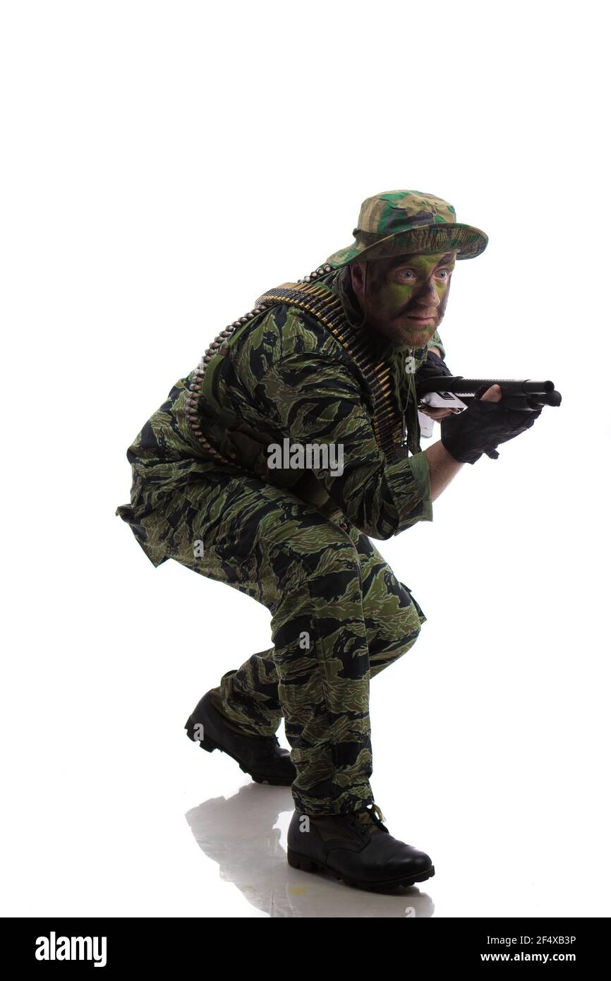 Man actor in the form of an American fur seal posing with a machine gun ...