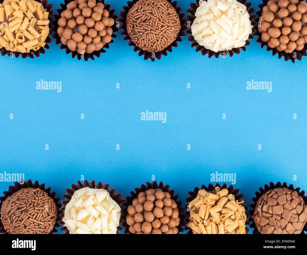 Typical brazilian brigadeiros, various flavors over colorful background ...