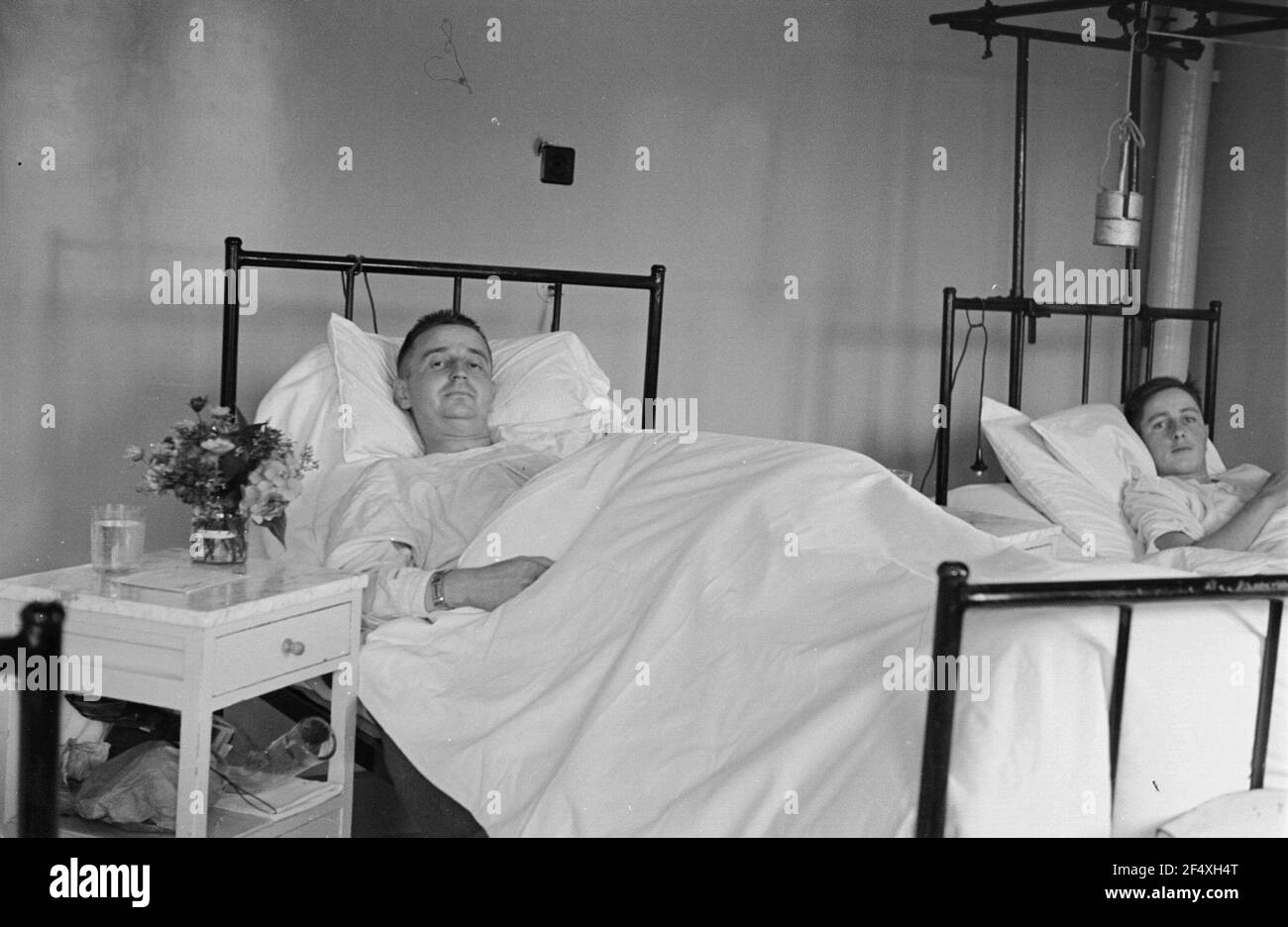 Second World War. Lazarett (probably in Holland). Two wounded relatives ...