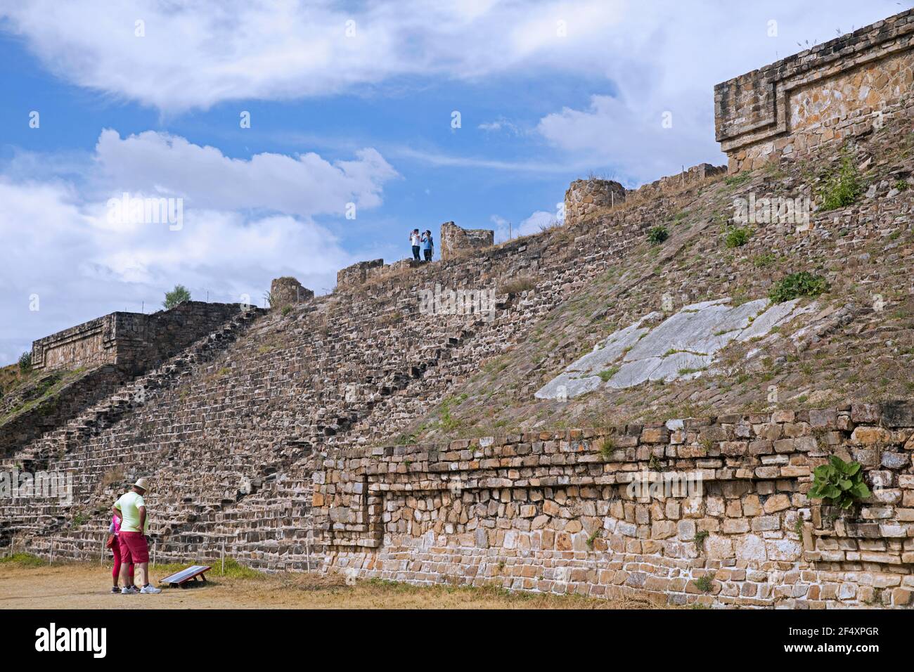 Tourists visiting the Monte Alban pyramid complex, pre-Columbian ...