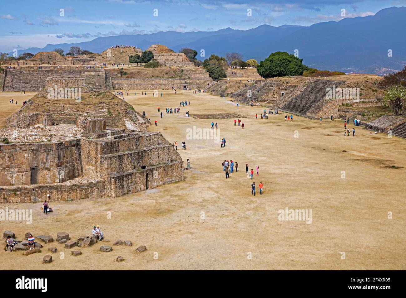 Tourists visiting the Monte Alban pyramid complex, pre-Columbian ...