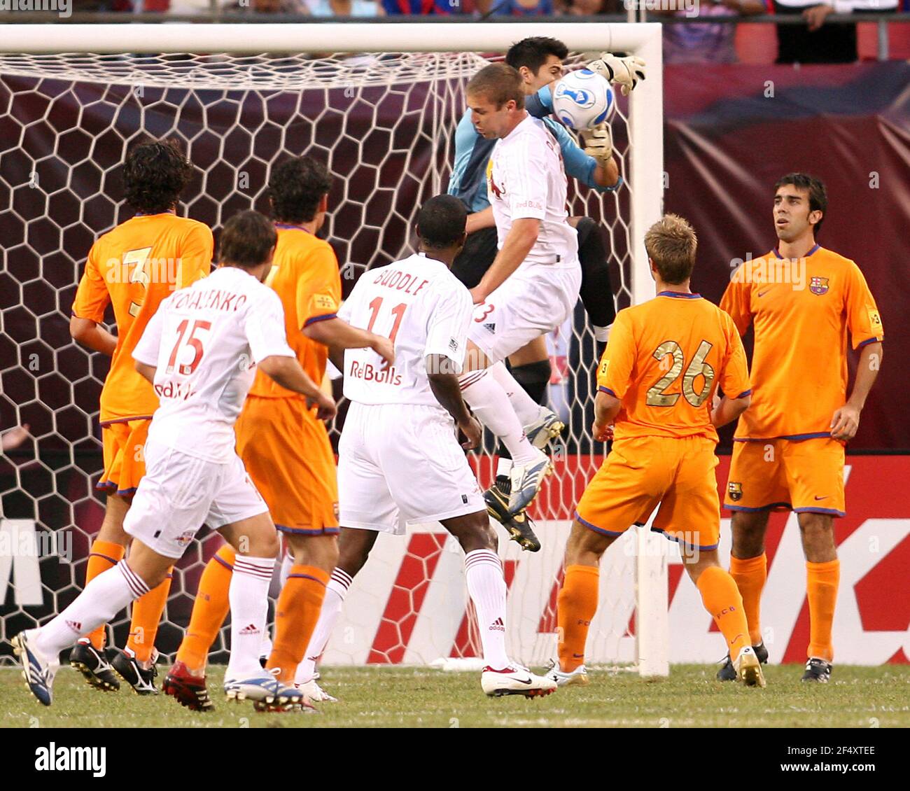 Danny O'Rourke clashes with Barcelona keeper Victor Valdes. FC ...