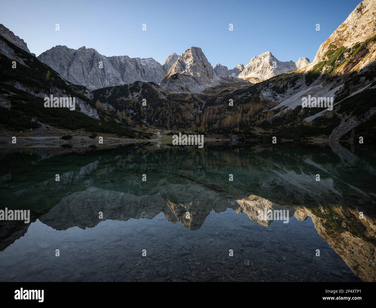 Seebensee lake mirror reflection of autumn fall alpine mountain sunset ...