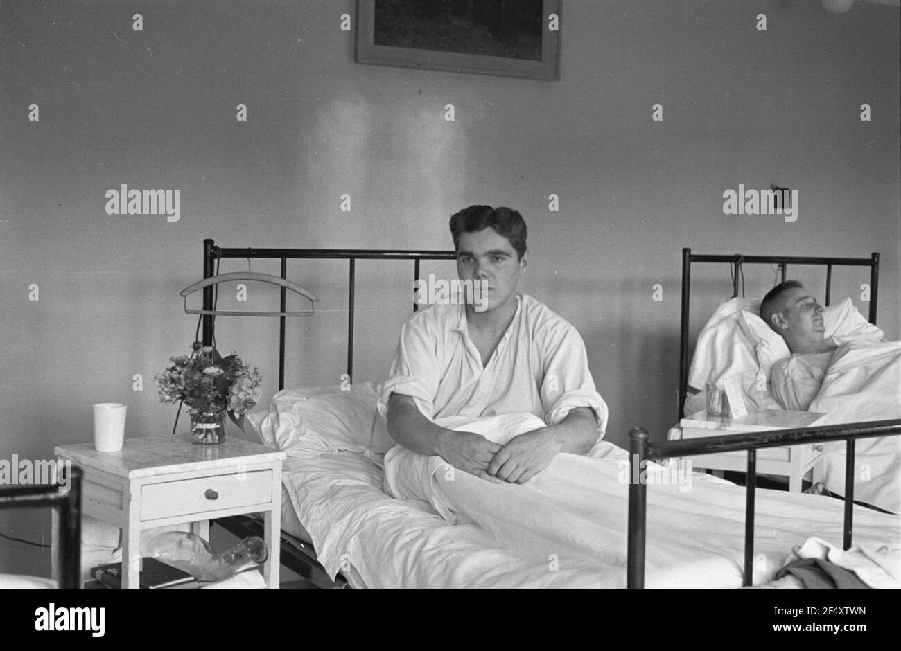 Second World War. Lazarett (probably in Holland). Two wounded relatives ...
