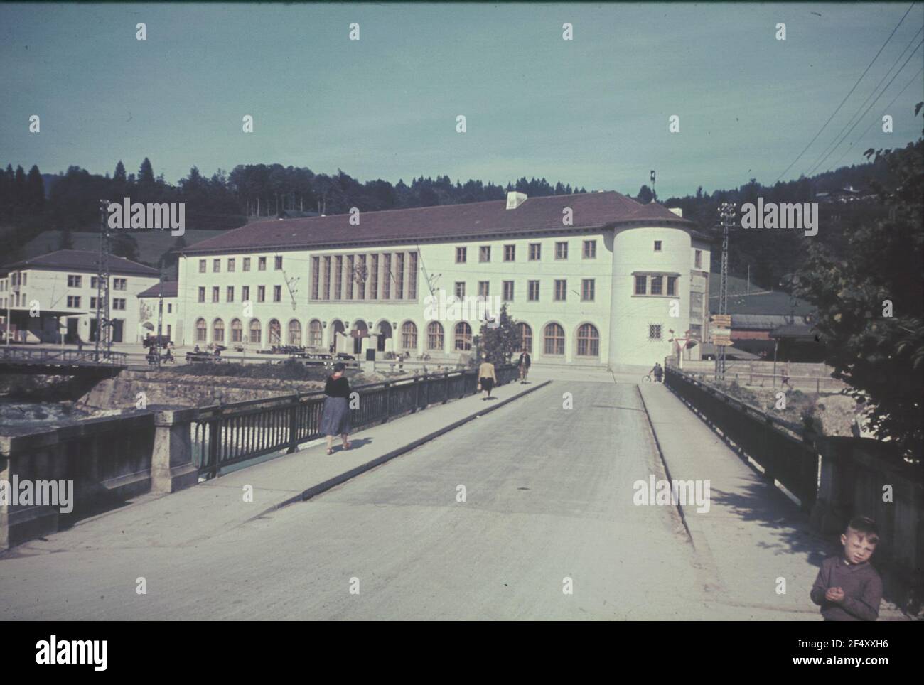 Germany. Probably in Bavaria. View over a bridge to a probably public ...
