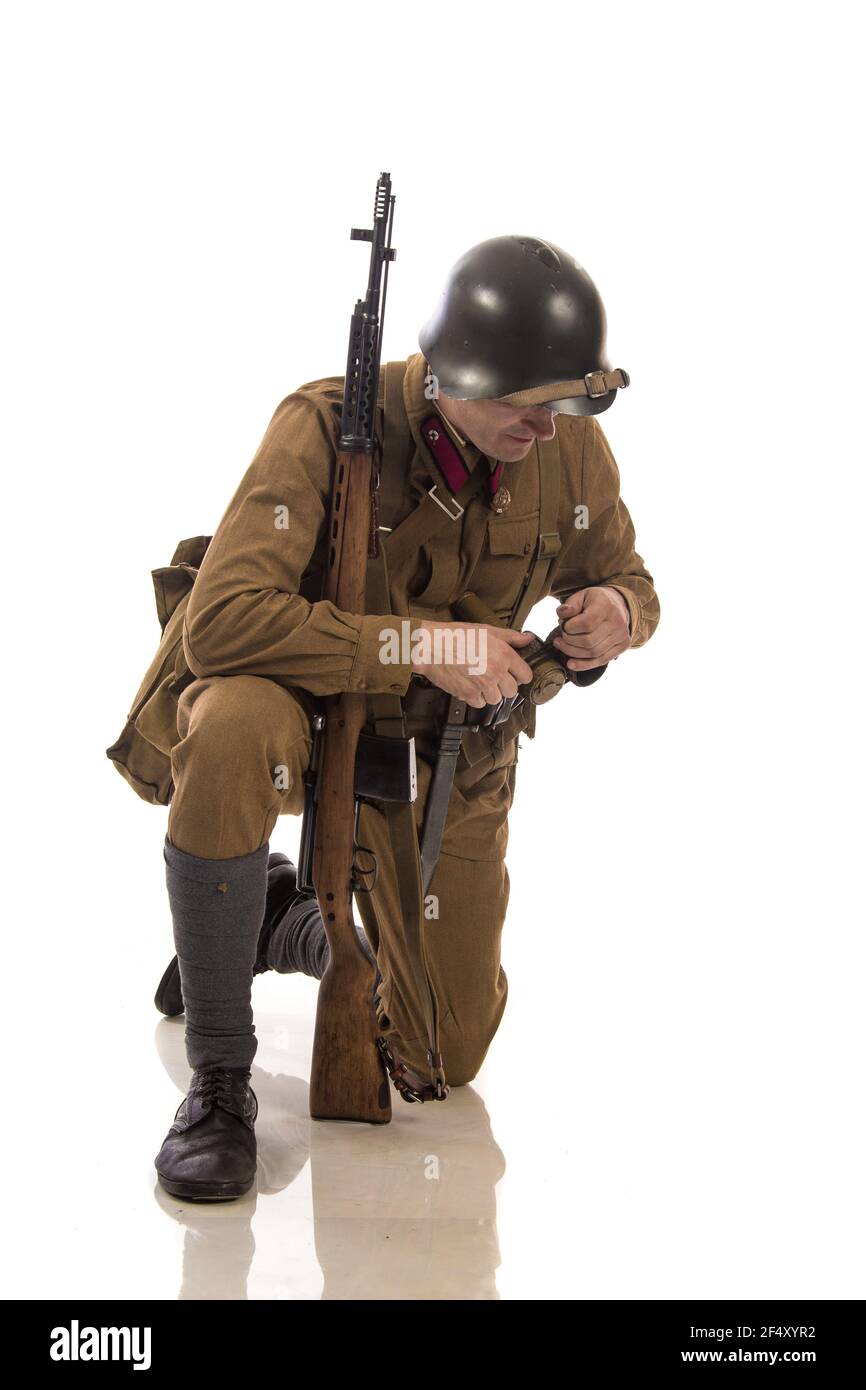 Male actor in uniform and helmet of ordinary soldiers of the Russian army in the period 1939 ...