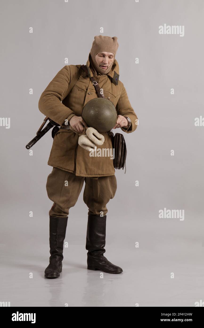 male actor in the winter military uniform of an officer of the Red Army ...