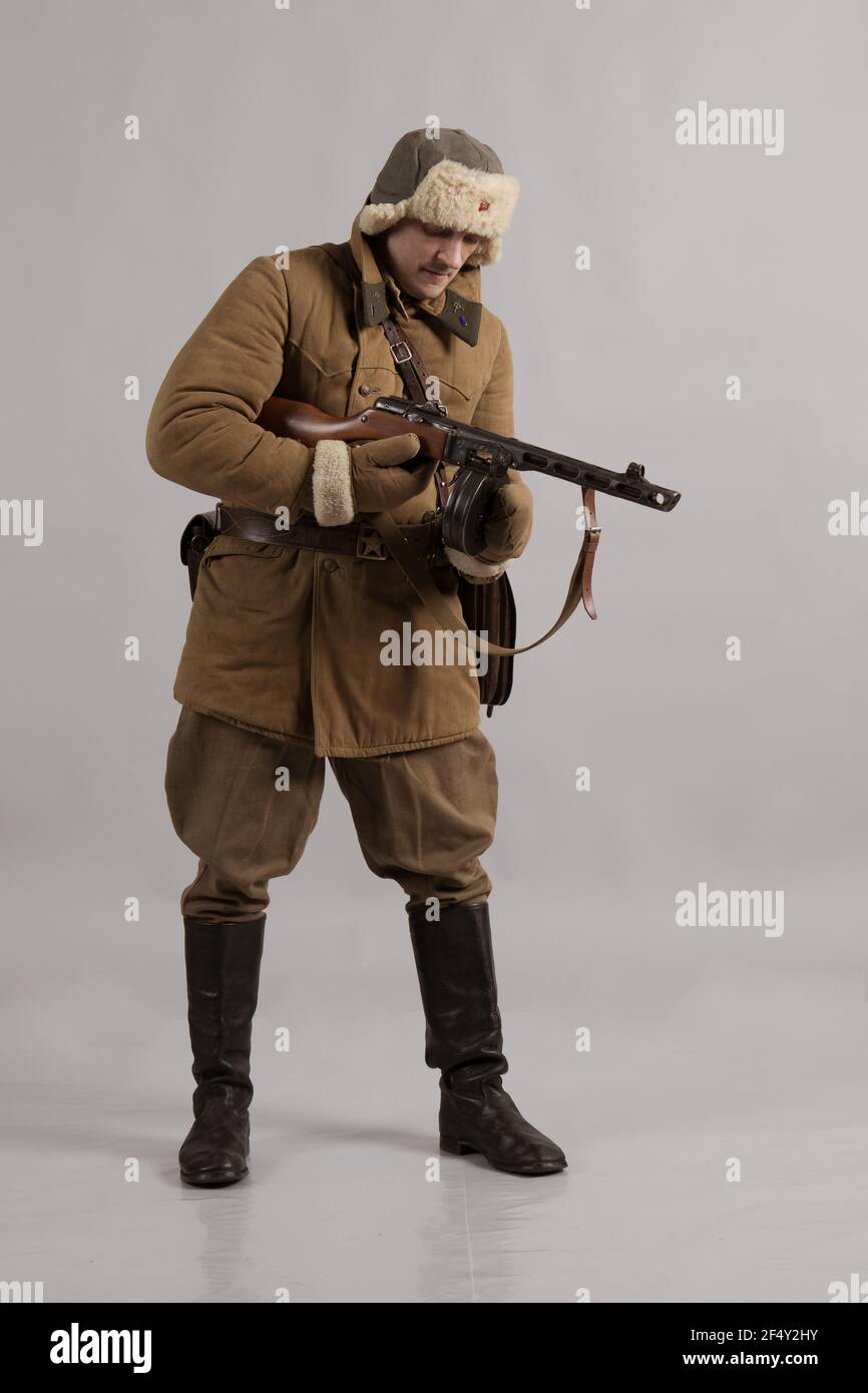 male actor in the winter military uniform of an officer of the Red Army ...
