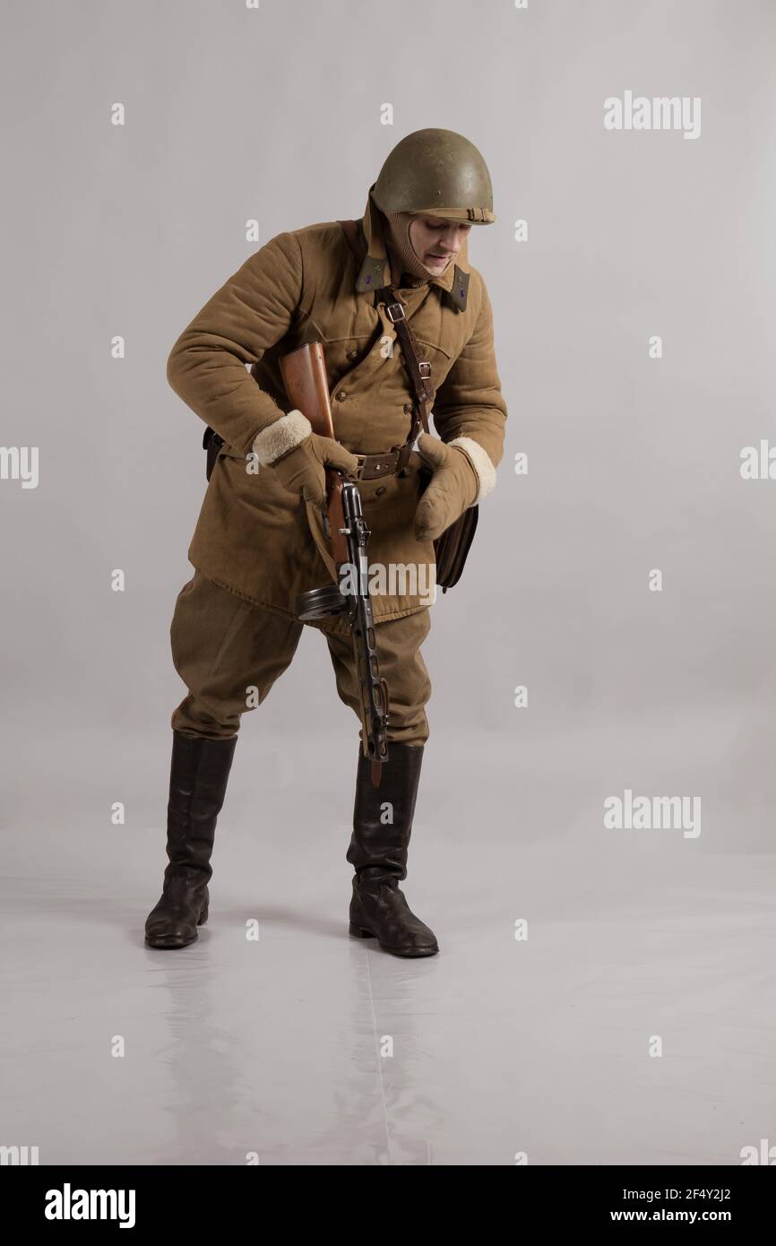 male actor in the winter military uniform of an officer of the Red Army ...