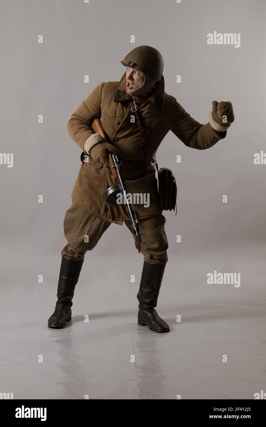 male actor in the winter military uniform of an officer of the Red Army ...