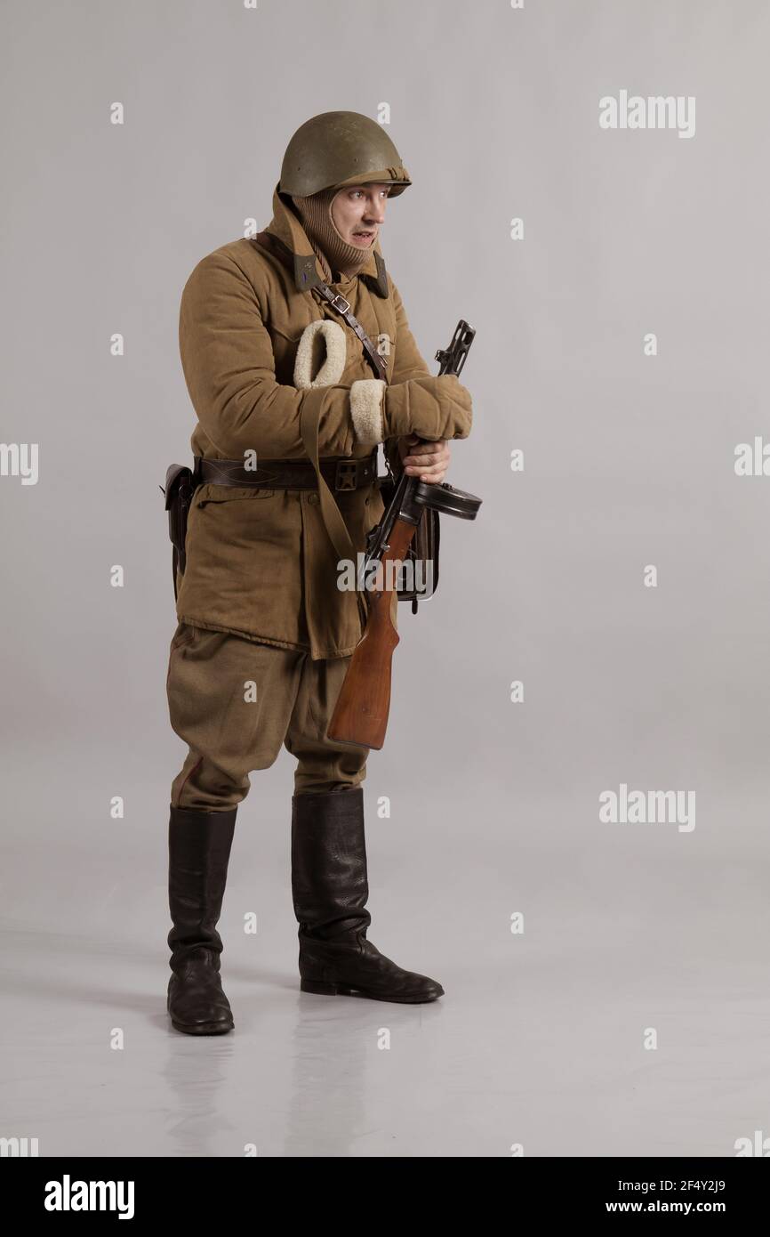 male actor in the winter military uniform of an officer of the Red Army ...