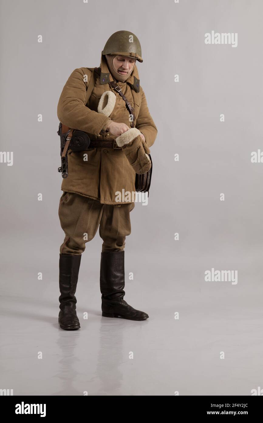 male actor in the winter military uniform of an officer of the Red Army ...