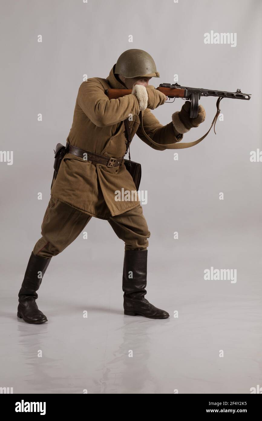 male actor in the winter military uniform of an officer of the Red Army ...