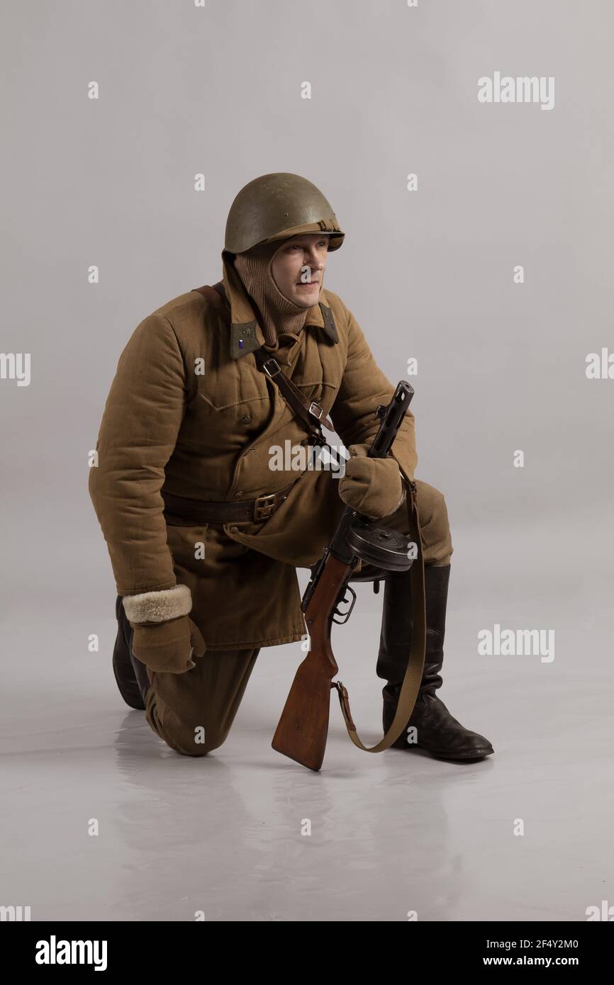 male actor in the winter military uniform of an officer of the Red Army ...