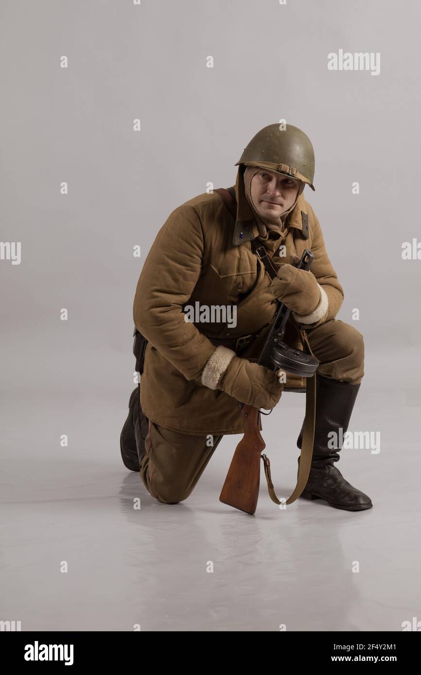 male actor in the winter military uniform of an officer of the Red Army ...